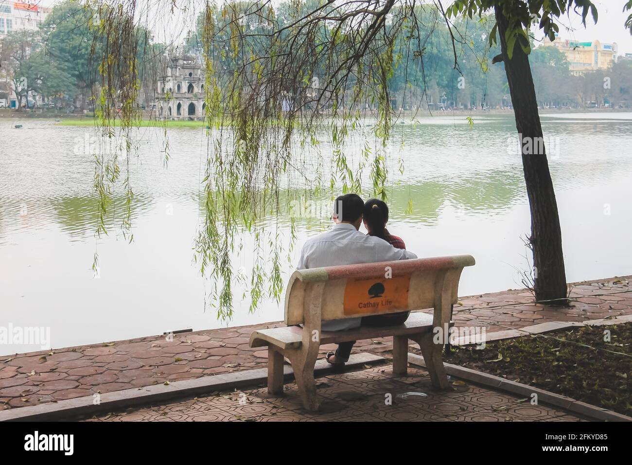 Hanoi, Vietnam - February 28 2019: A young romantic couple sit on a ...