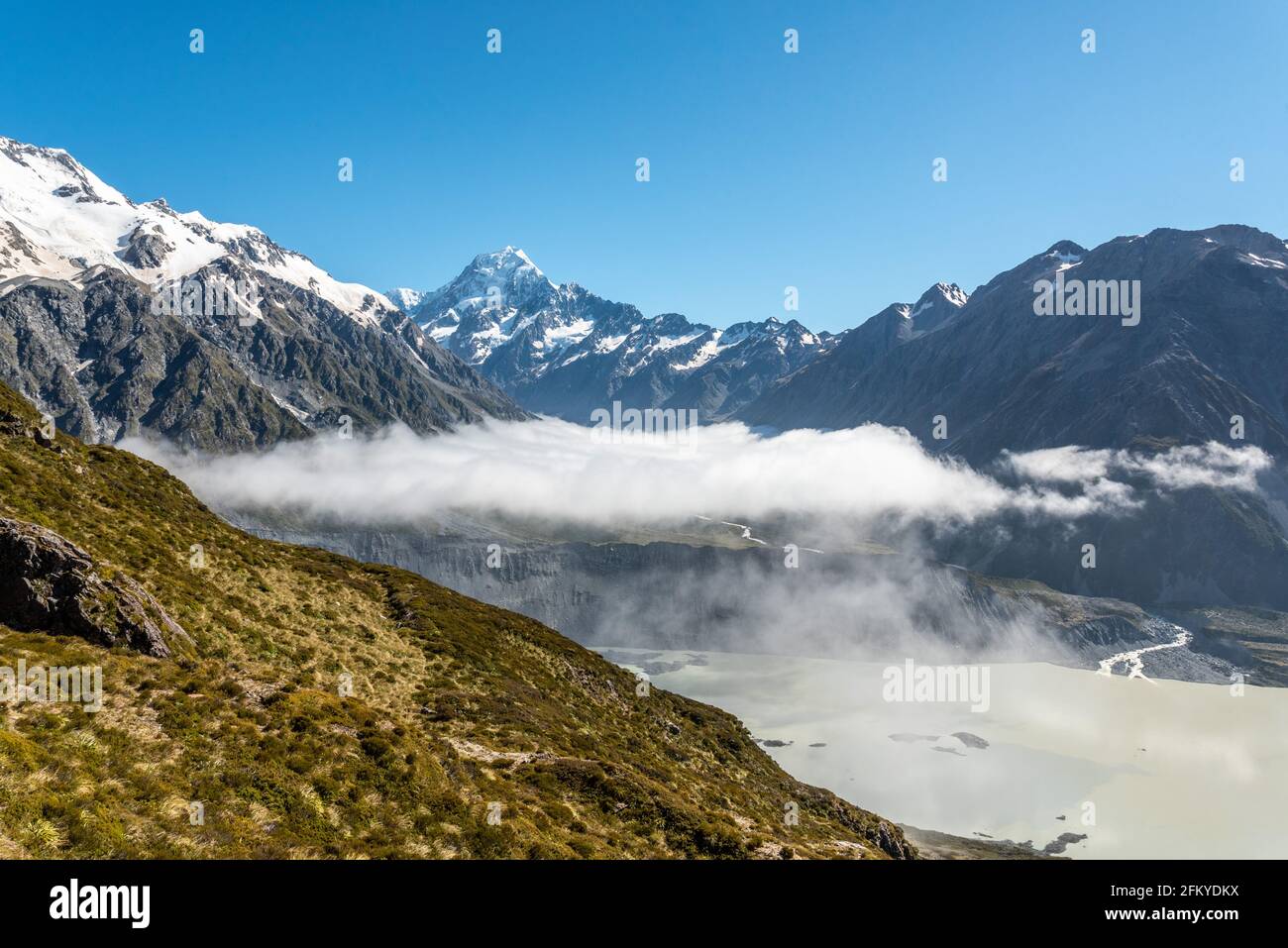 Cloudy view to the valley of Mount Cook National Park from Mueller Hut ...