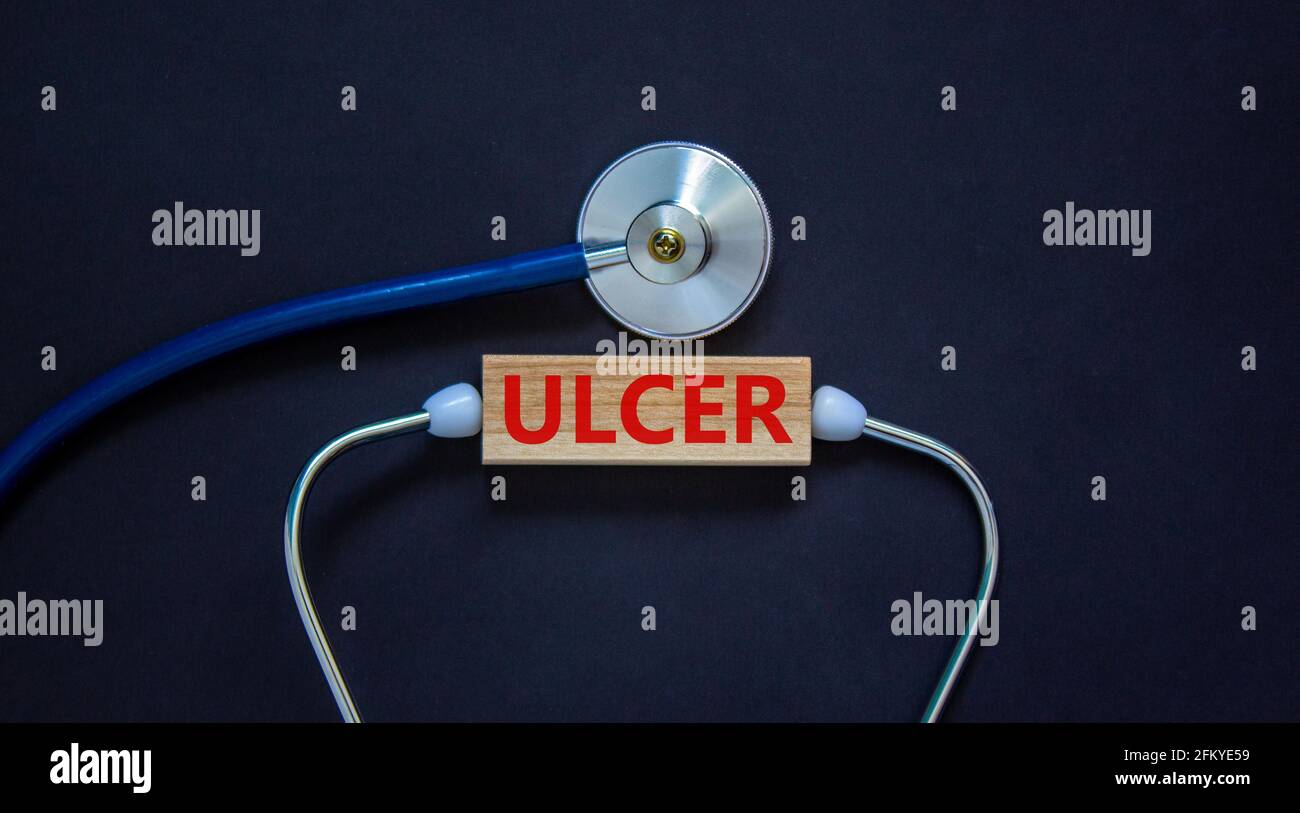 Ulcer symbol. Wooden block with the word 'ulcer' and stethoscope on ...