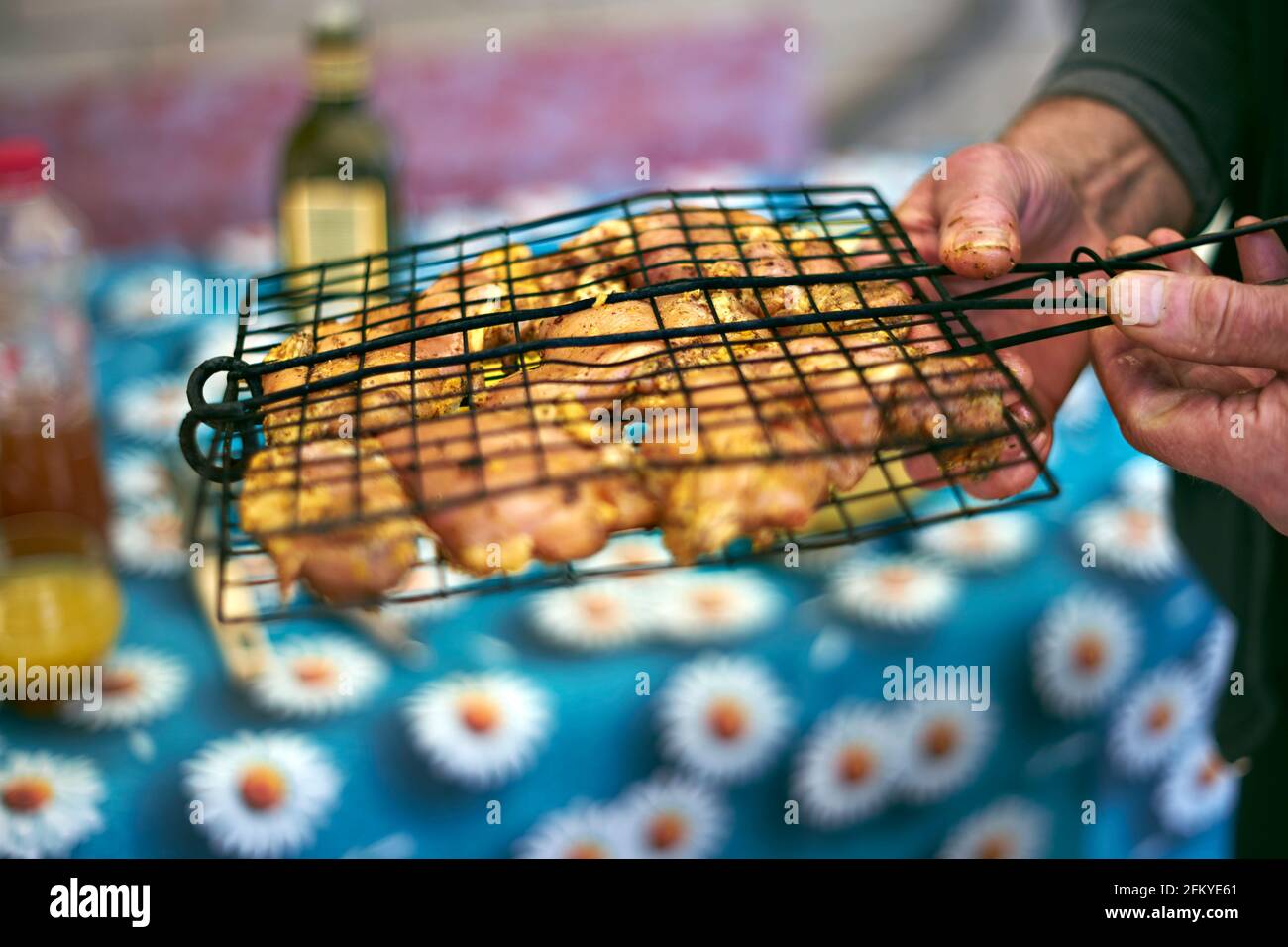 Barbeque. Selective focus on prepared chicken pieces on the wire rack ...