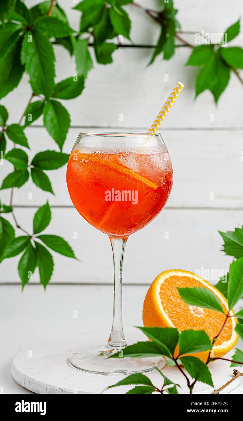 Aperol spritz cocktail with orange on white wooden backdrop Stock Photo ...