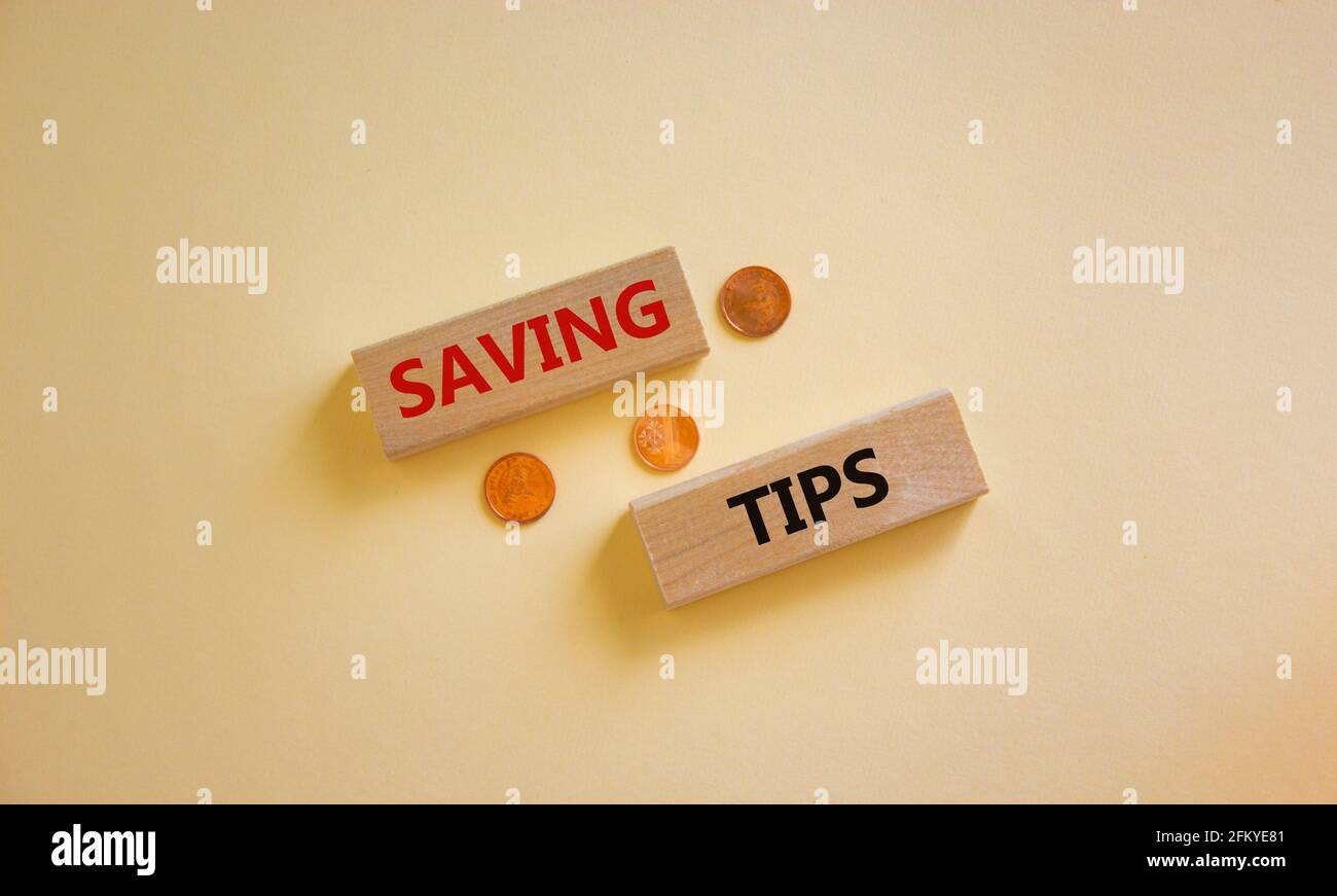 Saving tips symbol. Wooden blocks with words 'saving tips' on beautiful ...