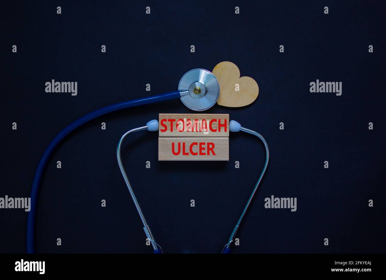 Stomach ulcer symbol. Wooden blocks with words 'Stomach ulcer' and ...