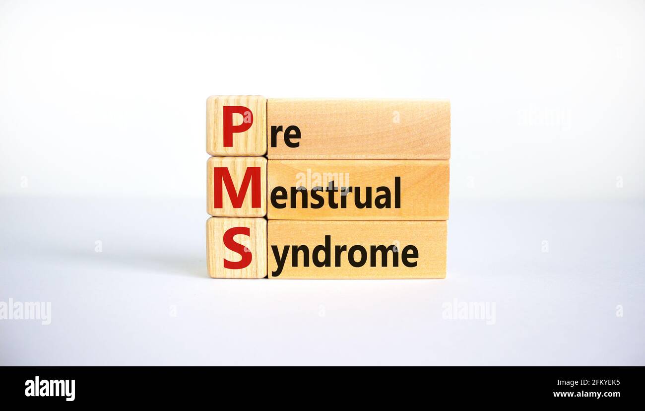 Medical and PMS, premenstrual syndrome symbol. Wooden cubes and blocks ...