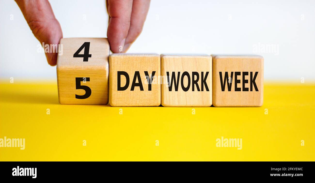 4 or 5 day work week symbol. Businessman turns the cube and changes ...