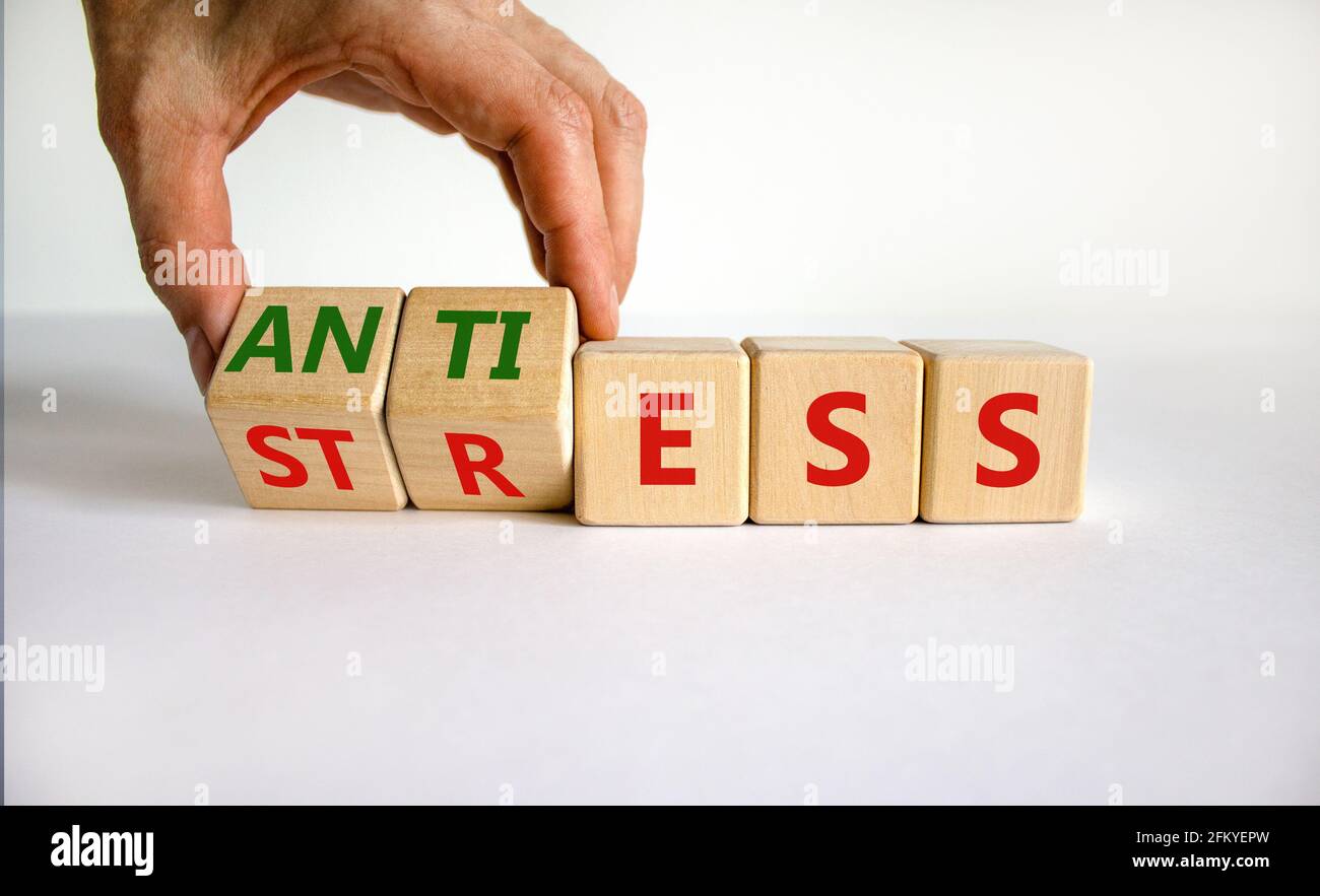 Antistress vs stress symbol. Doctor turns cubes and changes the word ...