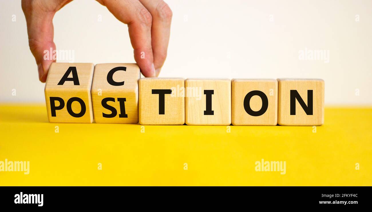 Action or position symbol. Businessman turns wooden cubes and changes ...