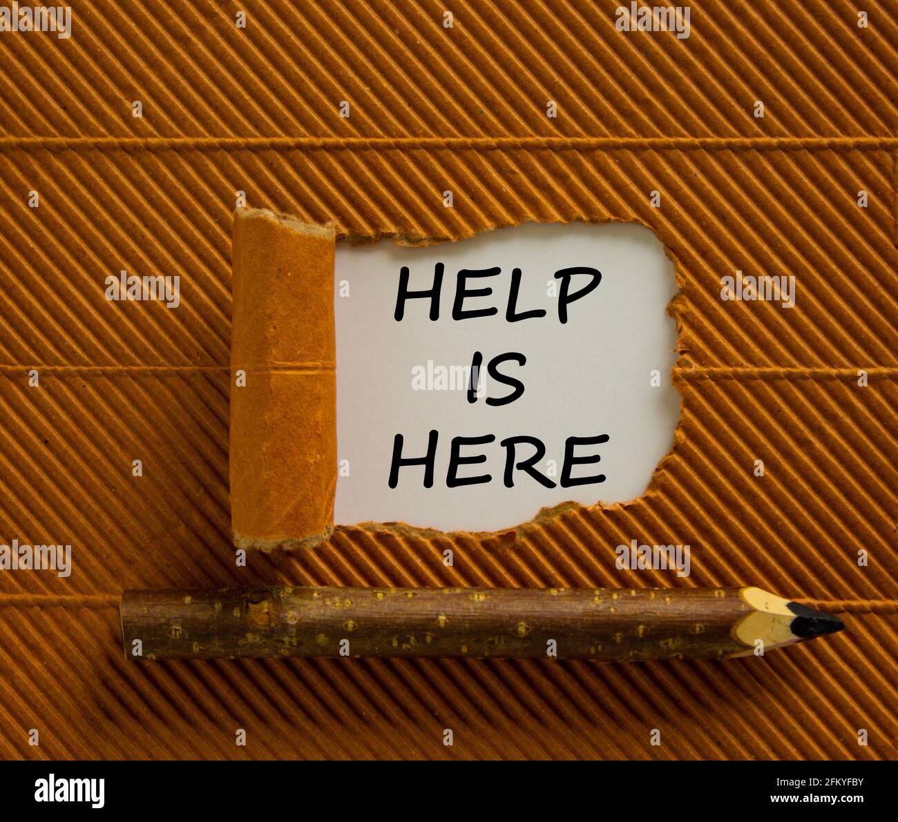 Support and help is here symbol. Words 'help is here' appearing behind ...