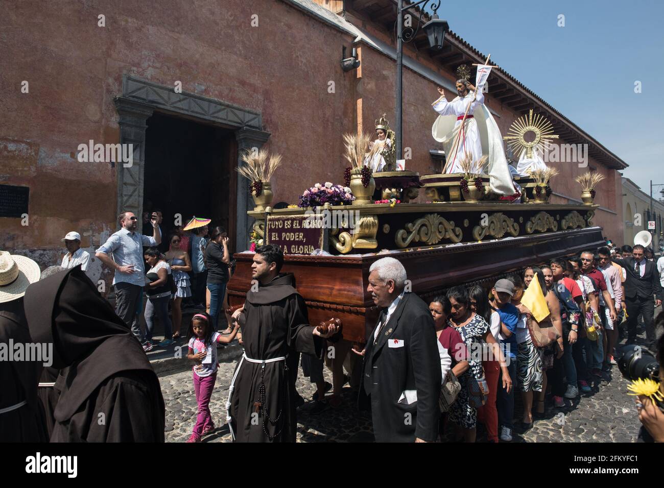 Women carry an elaborate wooden float (anda) during the Semana Santa ...