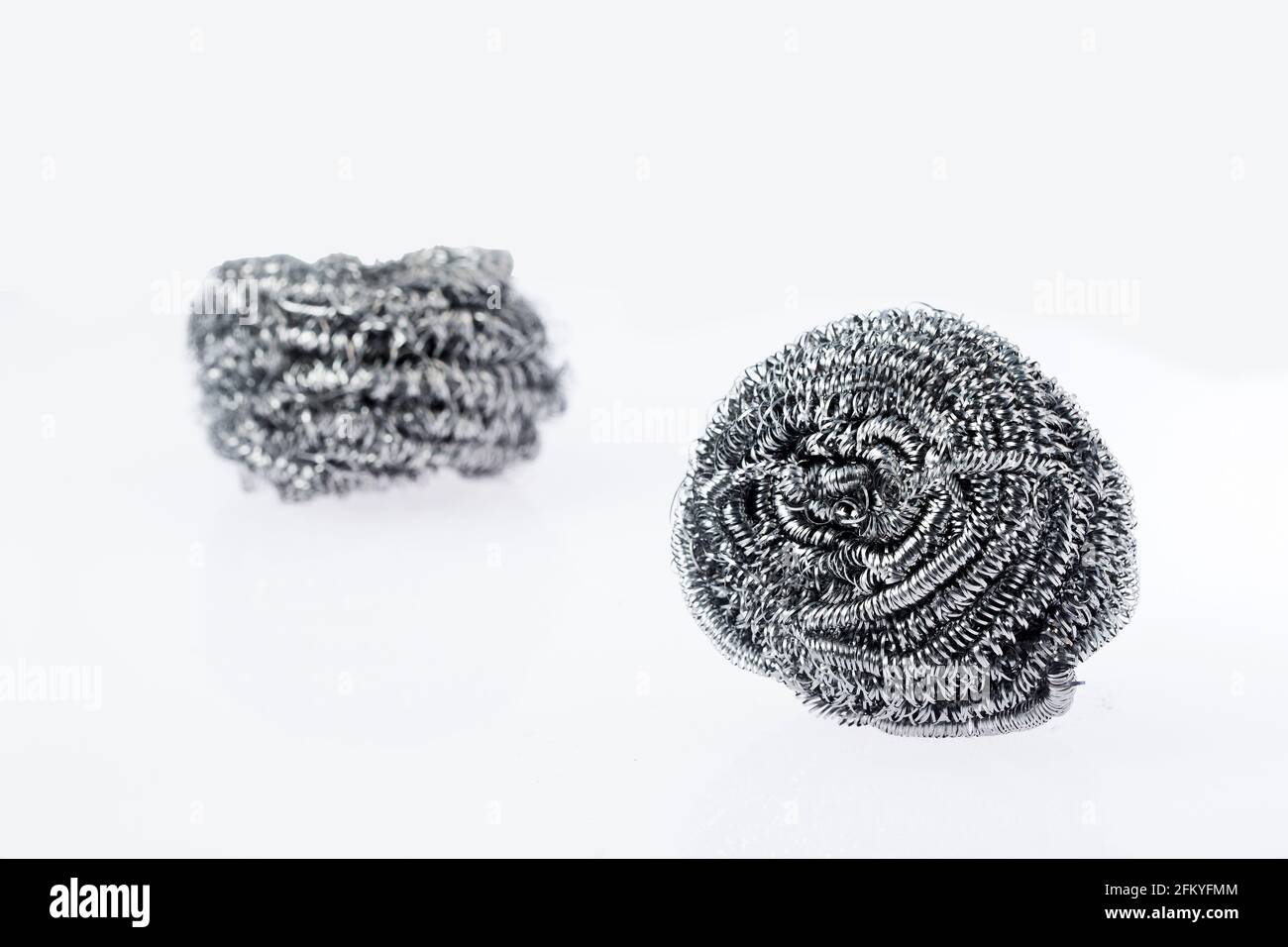 Metal kitchen sponge on white background - Text space Stock Photo - Alamy