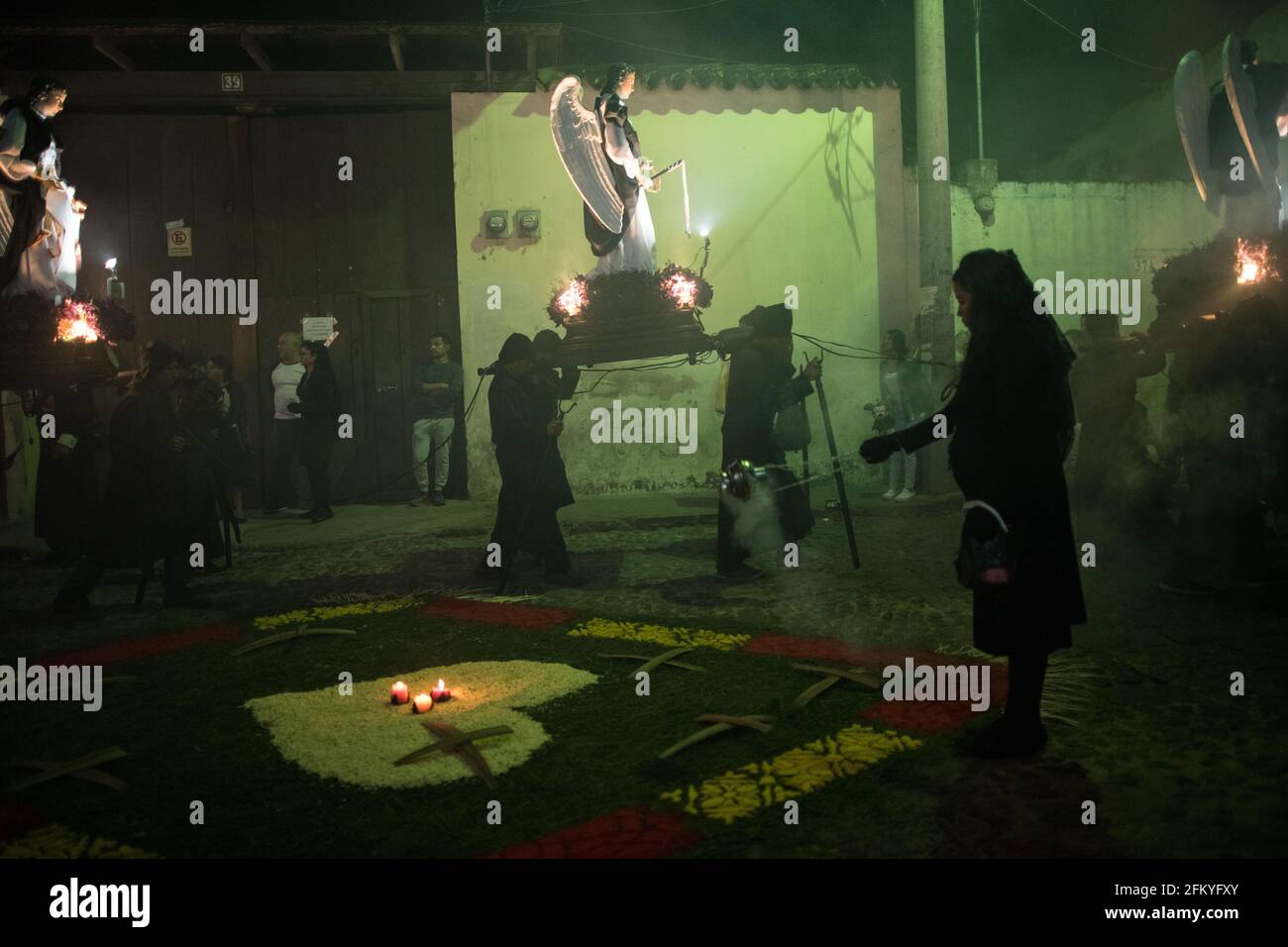 Illuminated angel andas carried by devoted marchers create an ethereal ...