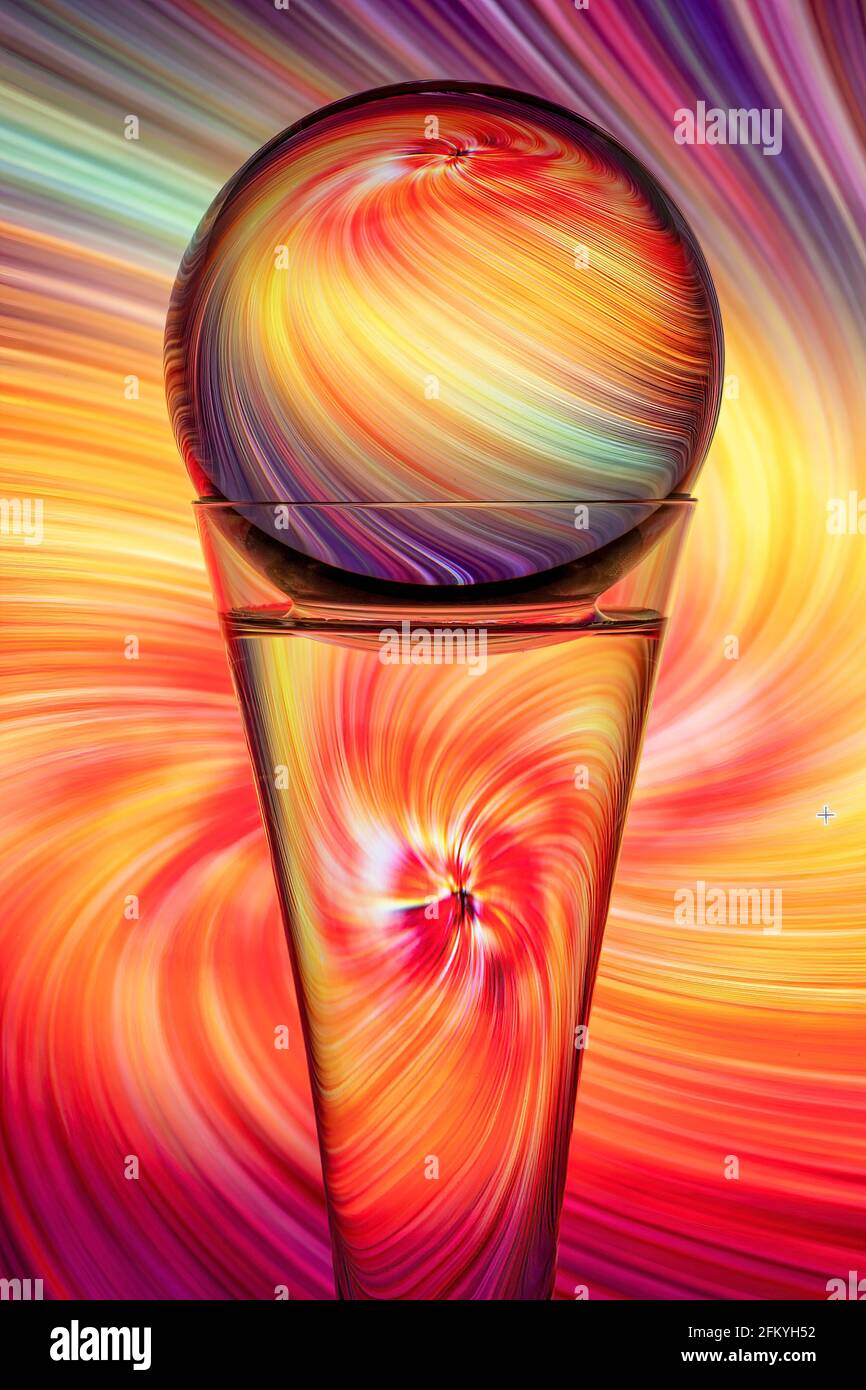 Light refraction caused by light traveling through a round glass globe ...