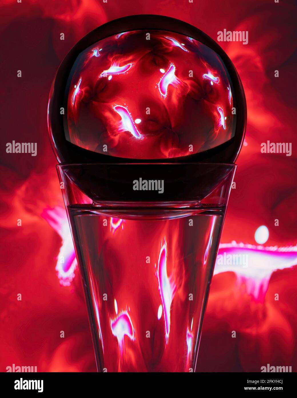 Light refraction caused by light traveling through a round glass globe ...