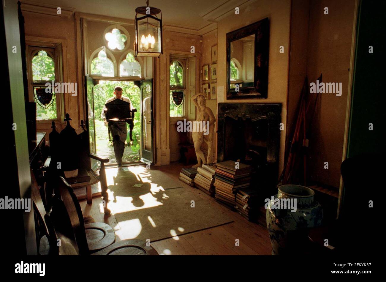 A CHRISTIES WORKER SEPTEMBER 2000 CARRIES IN A GEORGE 2 MAHOGANY CHAIR ...