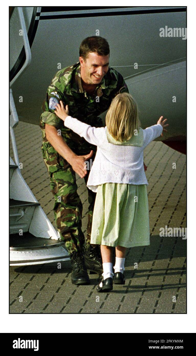 Major Harrison is met by his daughter Philippa (5) and his wife Carolyn ...
