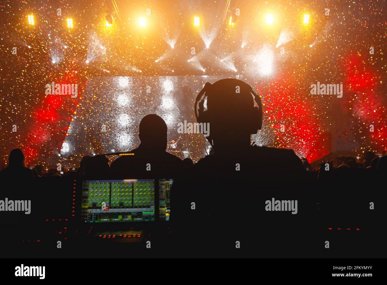 Sound engineer working at mixing panel on a big concert Stock Photo - Alamy