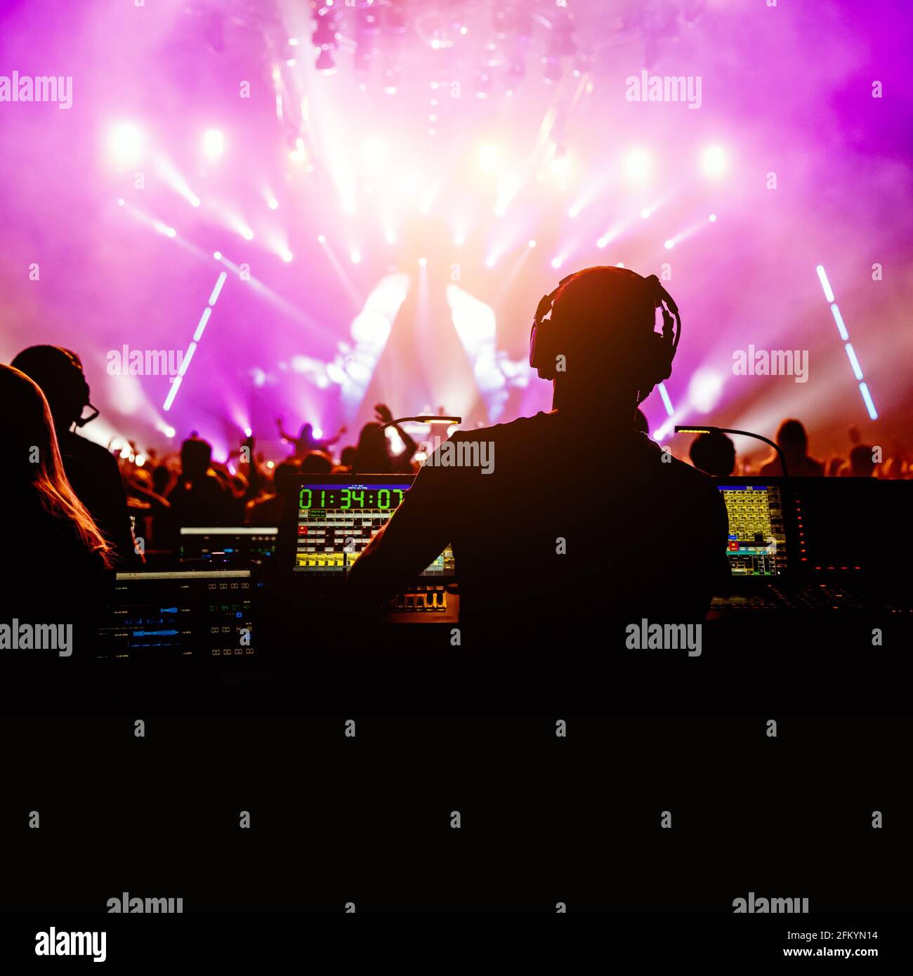 Sound engineer working at mixing panel on a big concert Stock Photo - Alamy