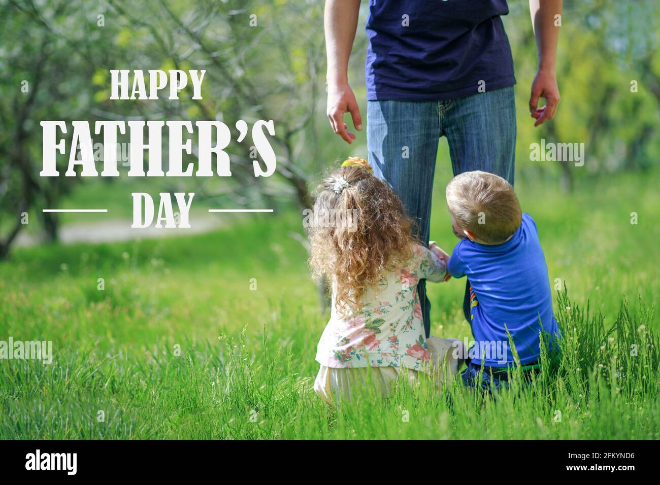 Text Happy father's day concept. children grabbed father's legs. Father ...
