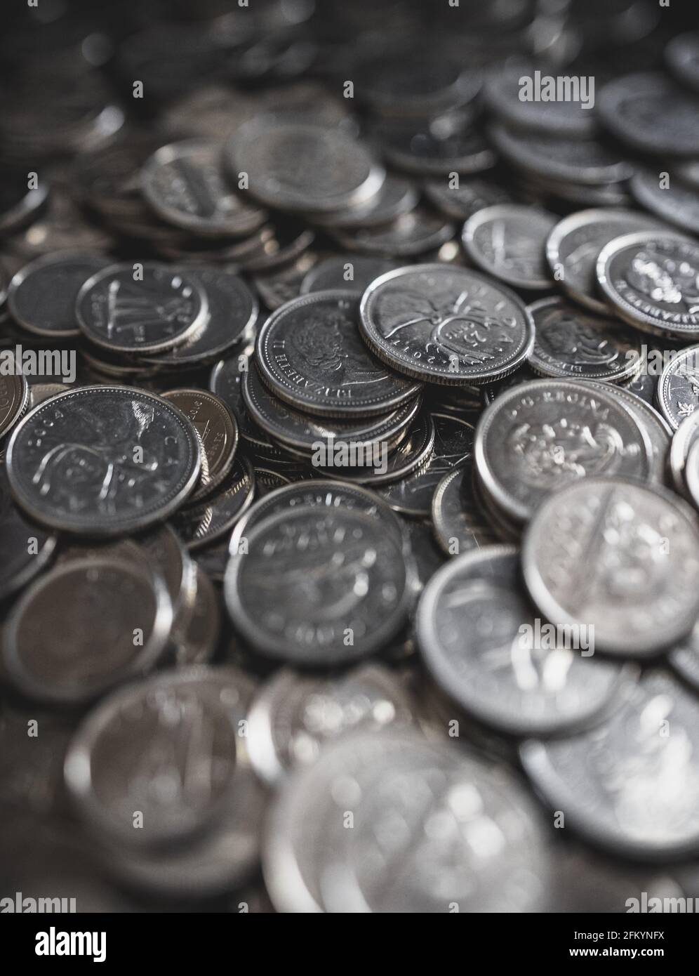Vertical background of silver shiny coins Stock Photo - Alamy