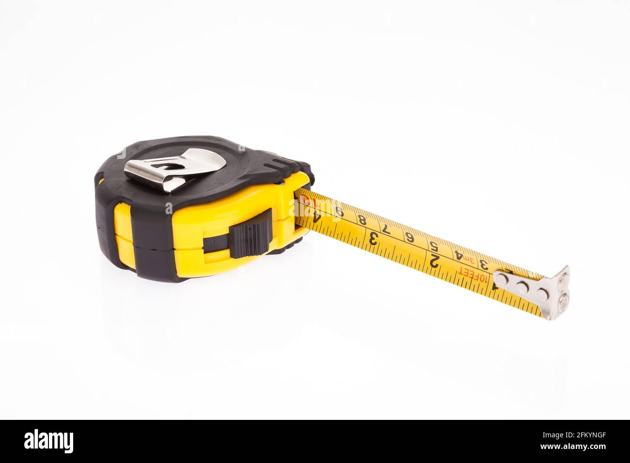 Yellow flexometer with black on white background Stock Photo - Alamy