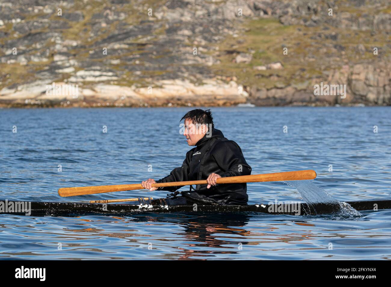 Local paddler demonstrates kayak techniques in the Greenlandic town of ...