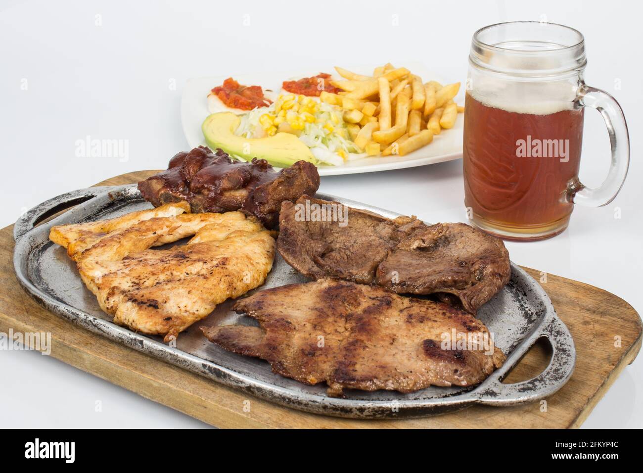 Food; Three different roast meats, with salad, french fries and a drink ...
