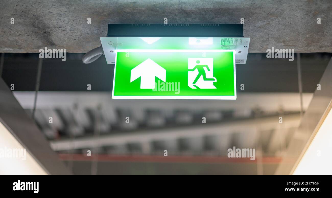 Emergency fire exit sign show the way to escape at the public area ...