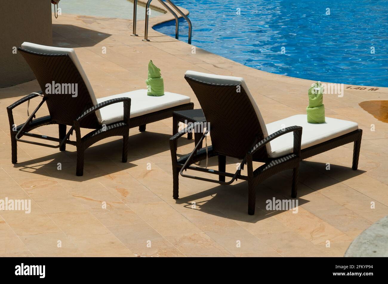 Lounge Chairs By The Swimming Pool Stock Photo - Alamy