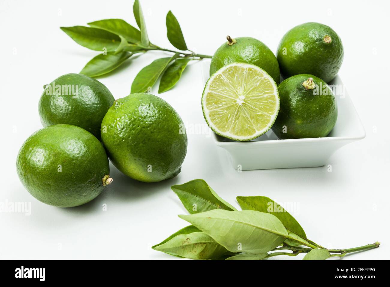 Green lemon tahiti or Citrus latifolia, isolated on neutral background ...