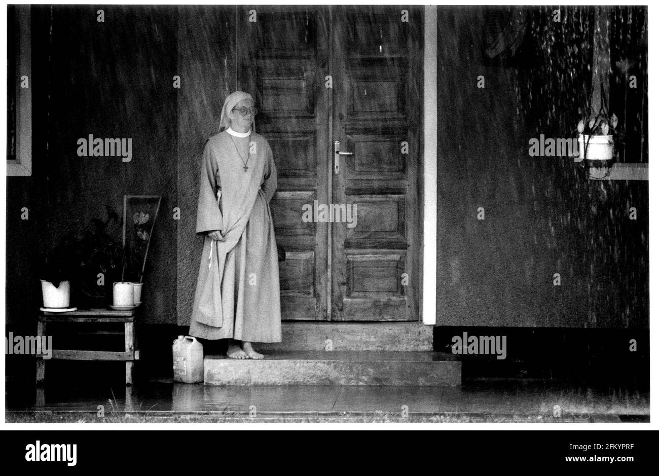 Picture by Mark Chilvers Nun in the rain Stock Photo - Alamy