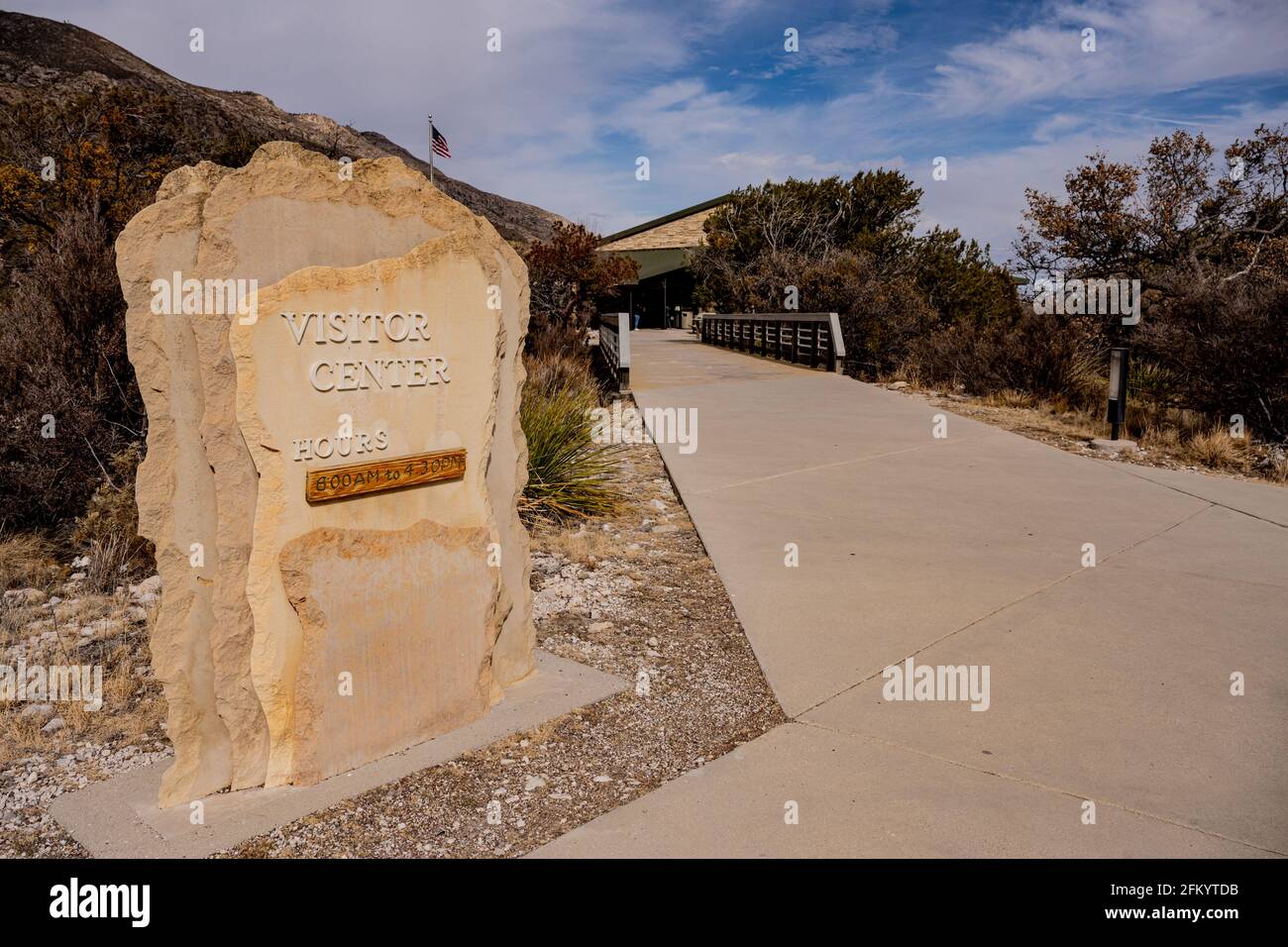 Guadalupe Mountains Visitor Center Sign in front of wide sidewalk Stock ...