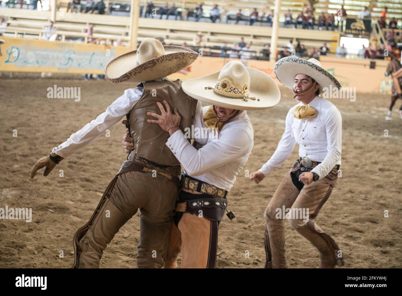 Charros prepare backstage for the charreada competition at the ...
