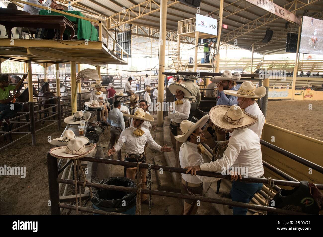 Charros prepare backstage for the charreada competition at the ...