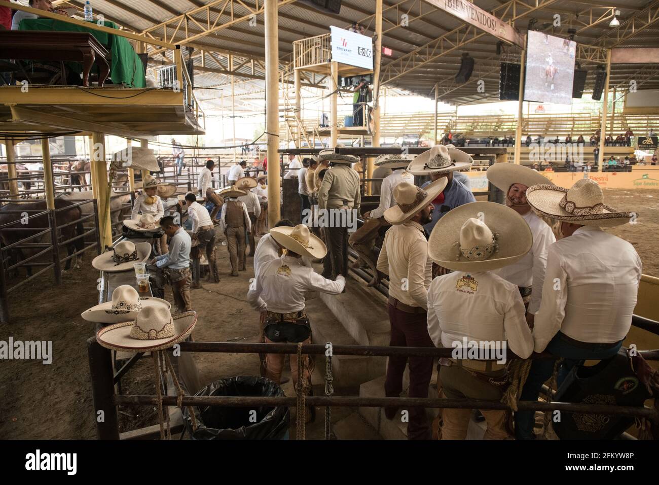 Charros prepare backstage for the charreada competition at the ...