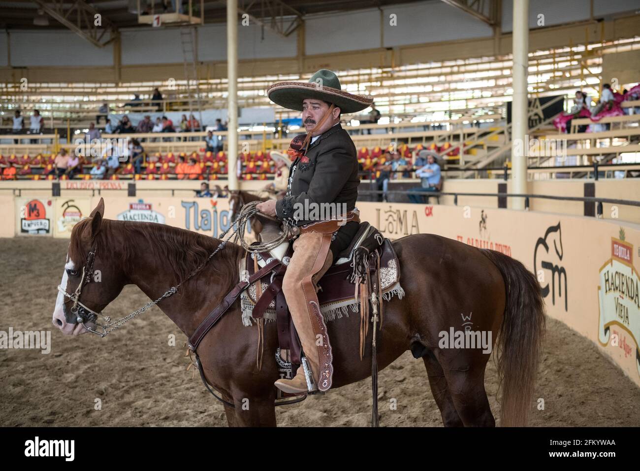 Charros prepare backstage for the charreada competition at the ...