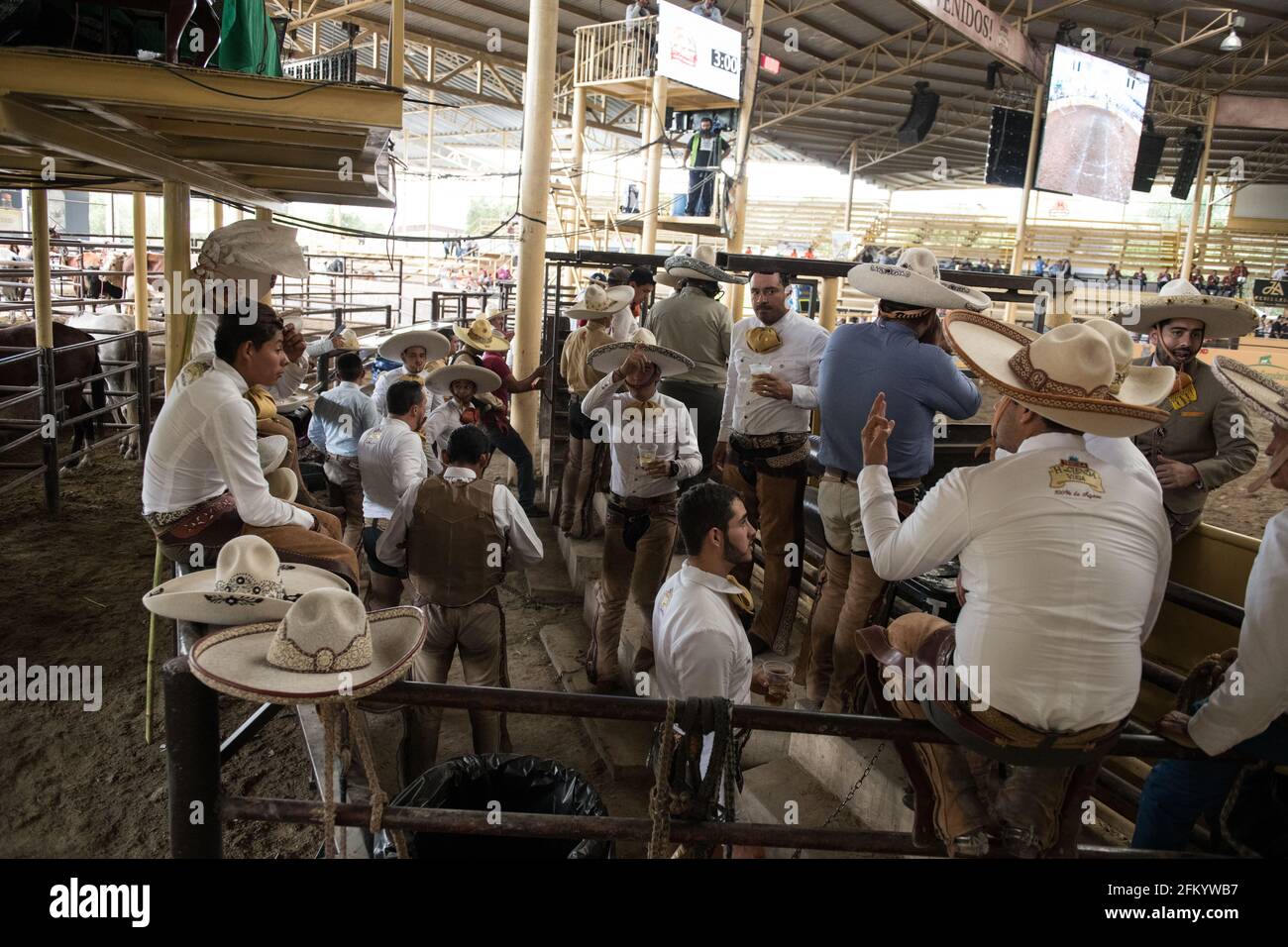 Charros prepare backstage for the charreada competition at the ...