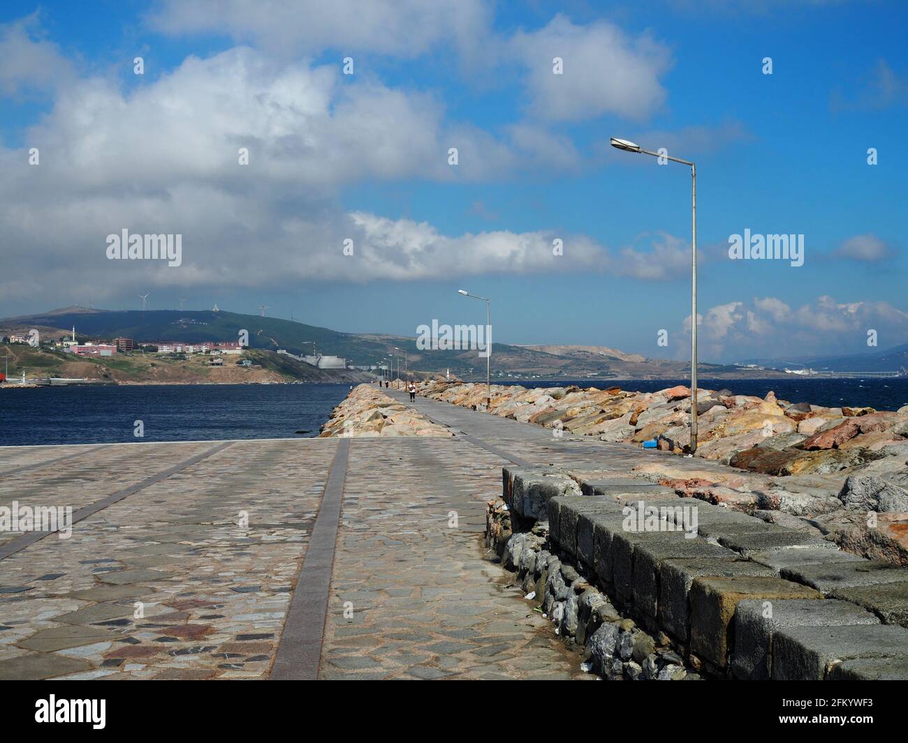 The small ligth tower in the end of the harbour way Stock Photo - Alamy