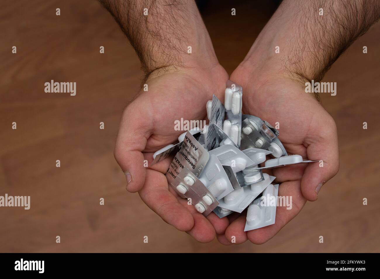 pill packets in hands Stock Photo - Alamy