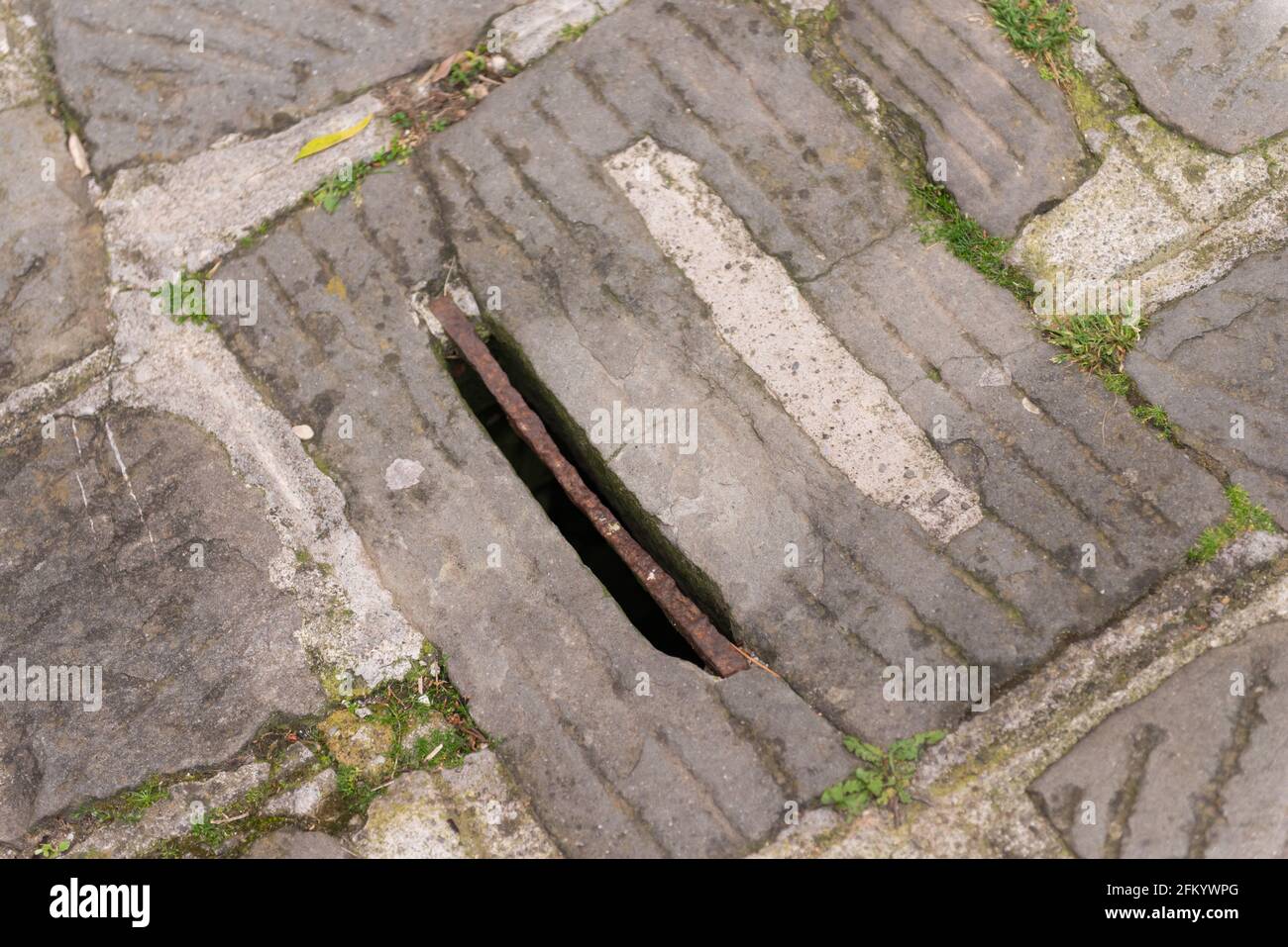 Stormwater runoff in the stone pavement of a medieval city. Sewers ...