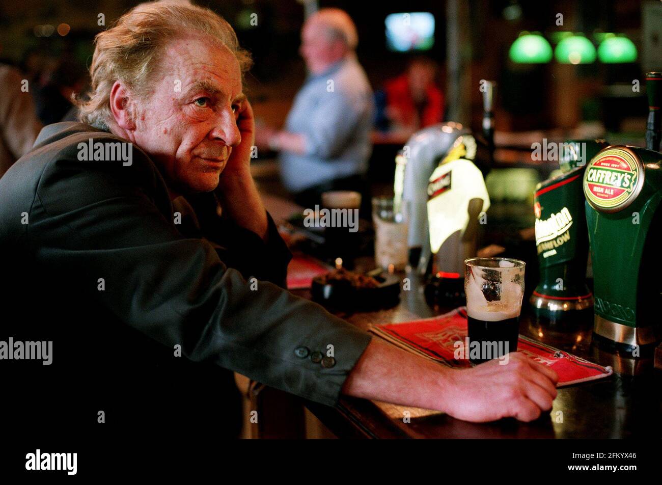 Locals at Ye Old Bell pub on Kilburn High Road in London are pictured ...