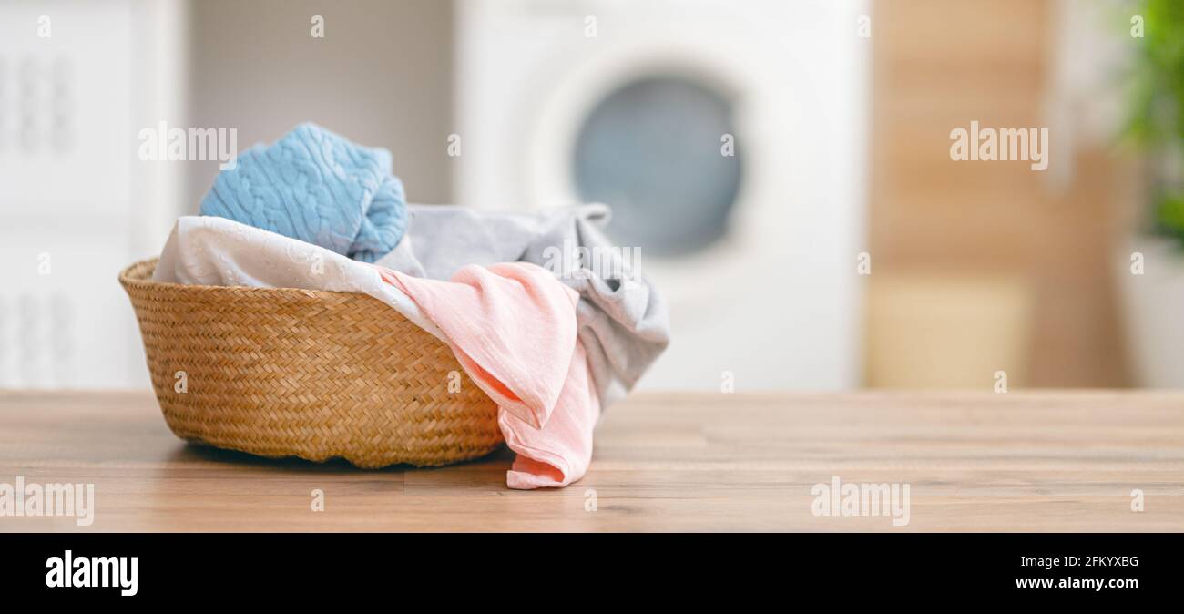 clothes in the basket in the laundry room Stock Photo - Alamy