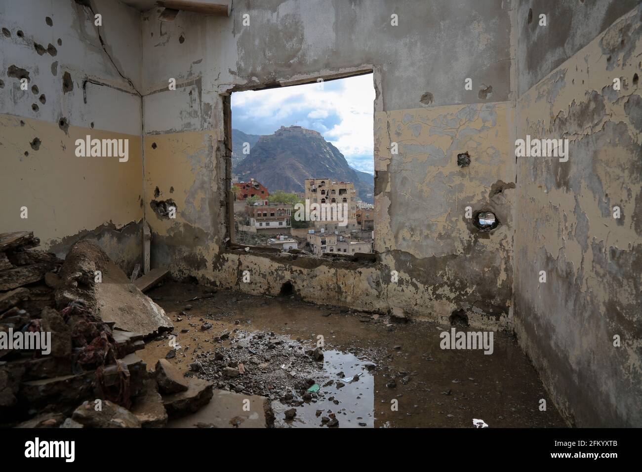 A building destroyed by the war, the city of Taiz, Yemen, and the ...