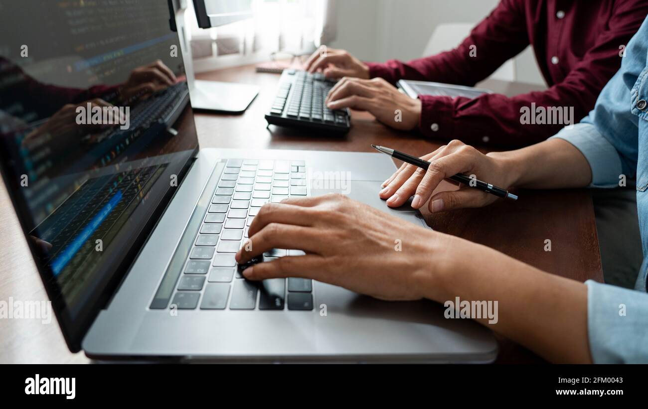 Developing programmer team hi-res stock photography and images - Alamy