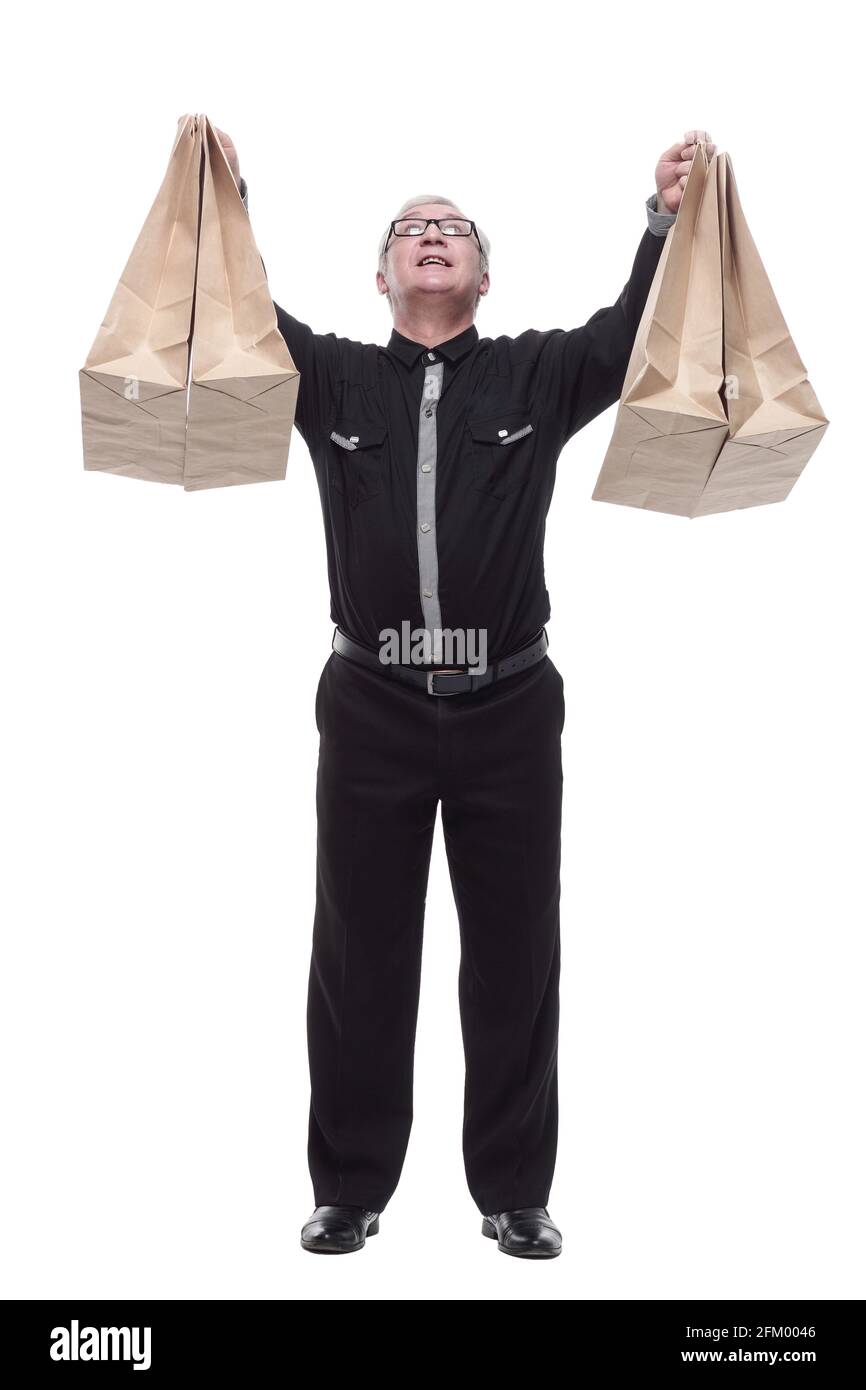 in full growth. happy casual man with shopping bags Stock Photo - Alamy
