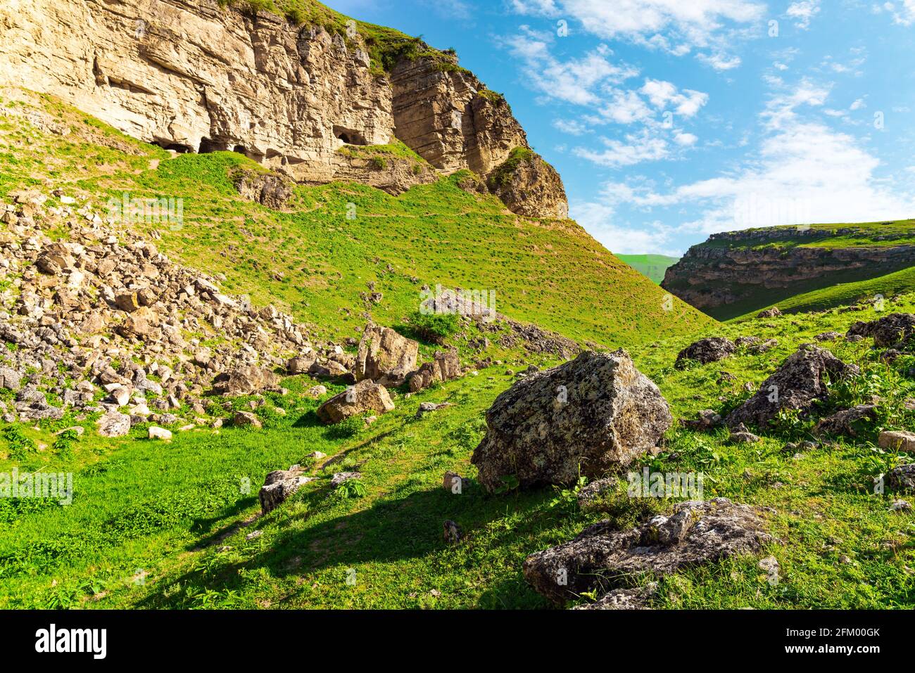 Green nature landscape with a fragment of a rock collapse Stock Photo ...