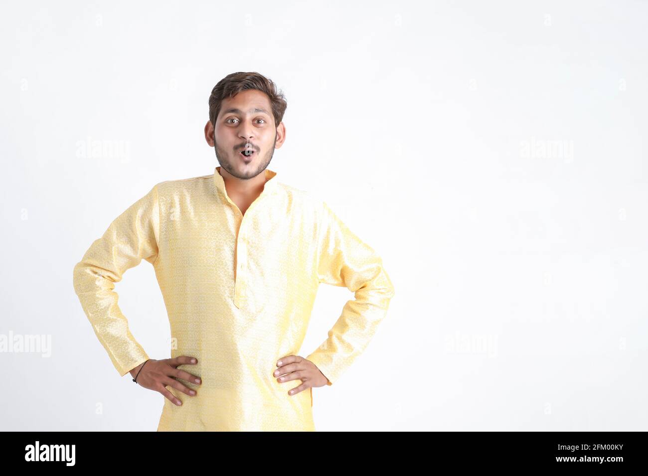 Indian man in tradition wear and showing excited expression on white ...