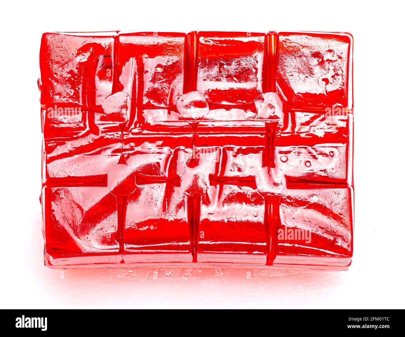 Red Jelly cubes on a white background Stock Photo - Alamy