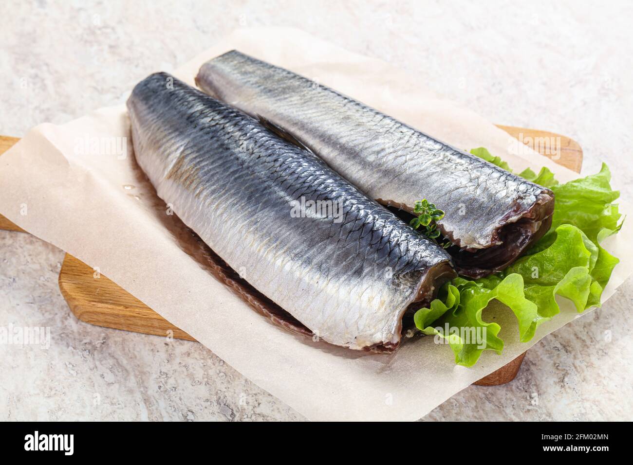 Marinated Herring fillet with skin for cooking Stock Photo - Alamy