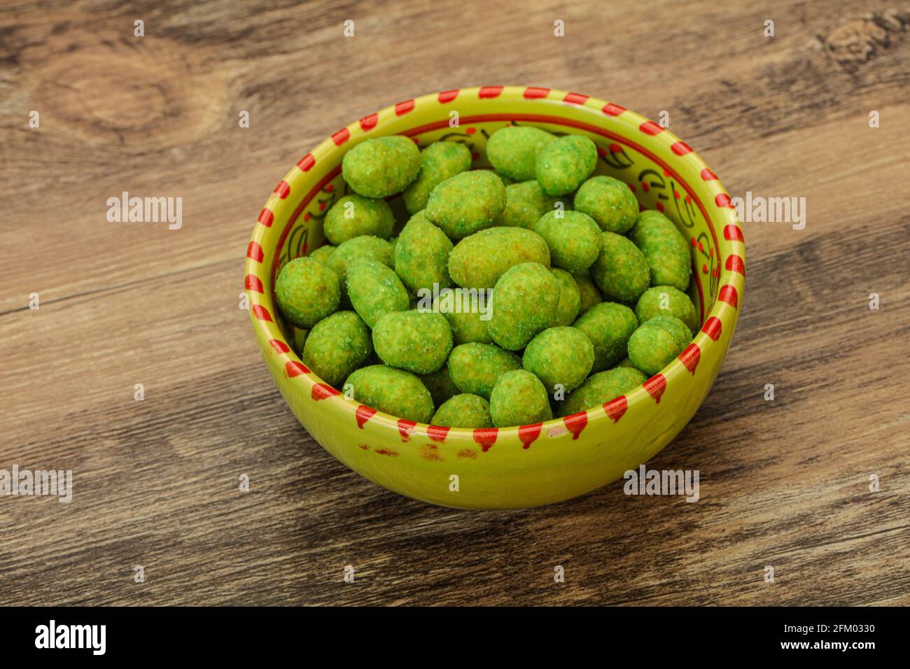Spicy wasabi peanuts snack in the bowl Stock Photo - Alamy
