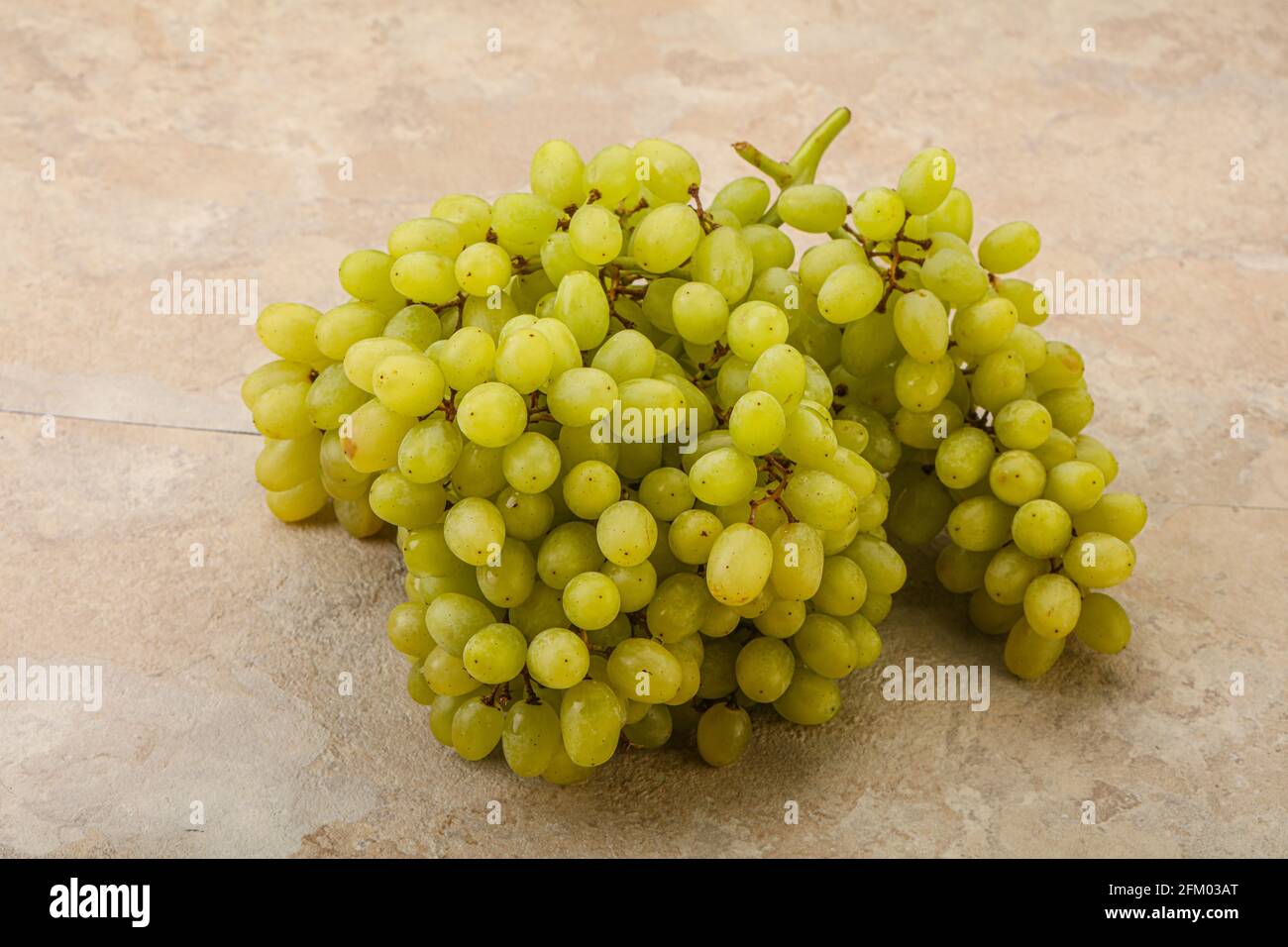 Sweet Green grape branch over background Stock Photo - Alamy